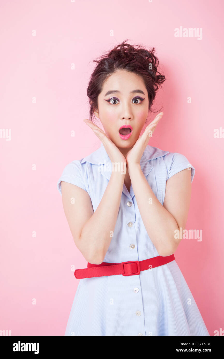 Young woman in retro style staring at front with a surprised face Stock ...