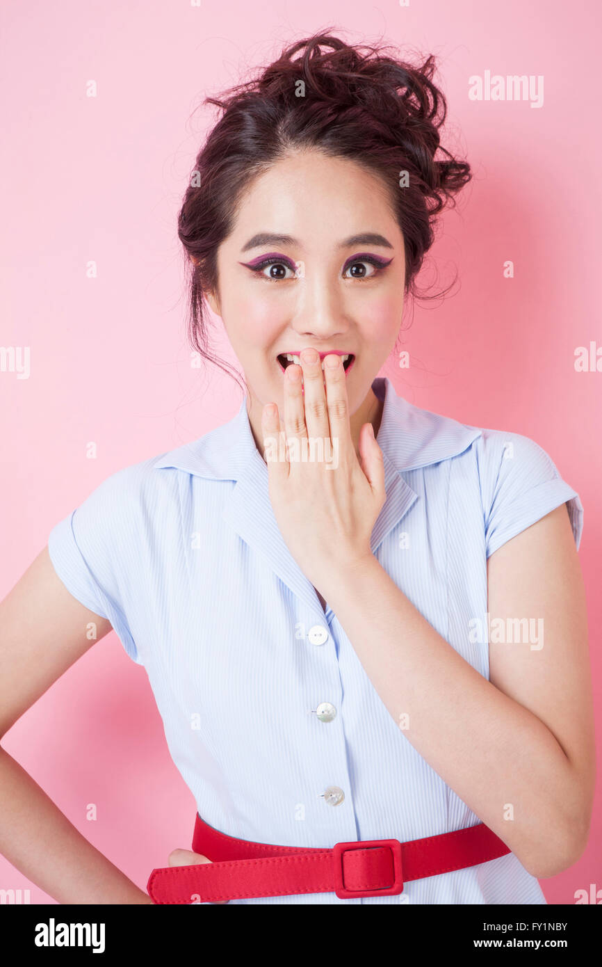 Portrait of young woman in retro style staring at front with a ...