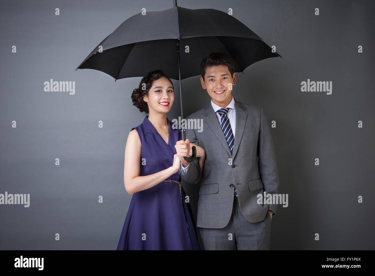 Umbrella sharing hi-res stock photography and images - Alamy