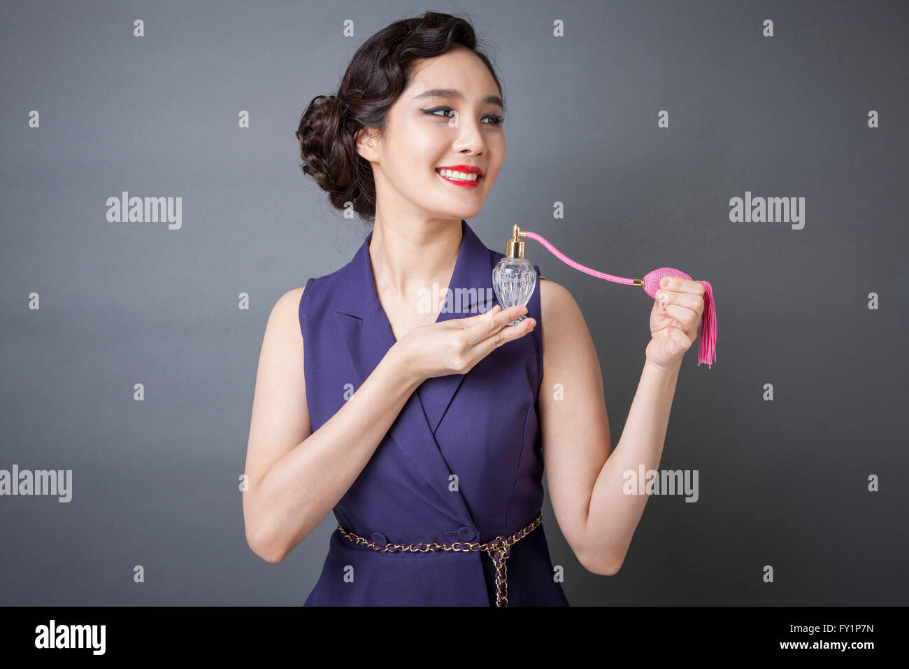 Woman spraying perfume retro hi-res stock photography and images - Alamy