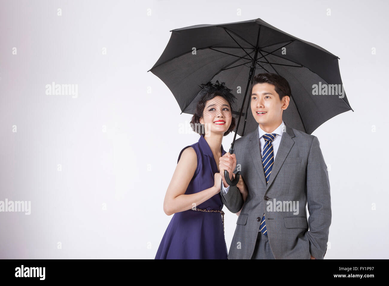 Sharing umbrella hi-res stock photography and images - Alamy