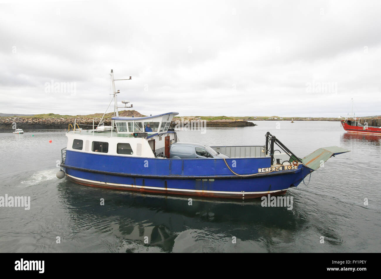 The Arranmore ferry leaving the harbour at Burtonport, County Donegal ...