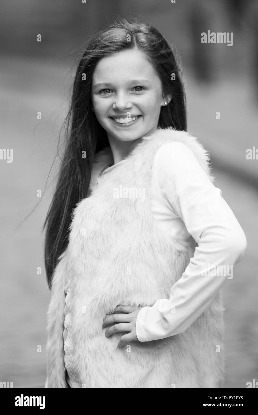Young girl posing white background Black and White Stock Photos ...