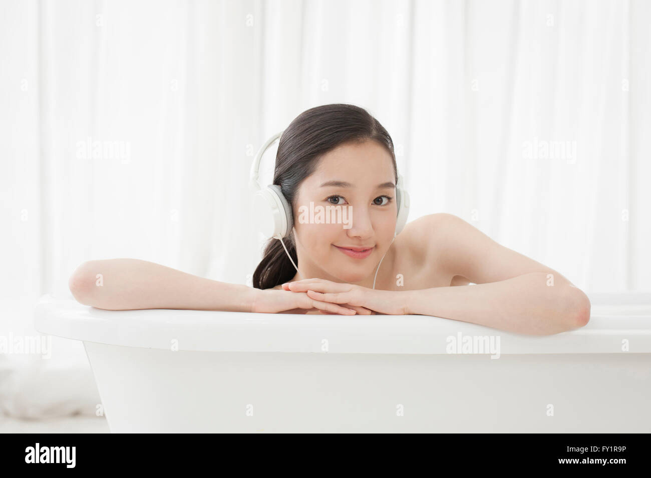 Listening to music in bath tub hi-res stock photography and images - Alamy