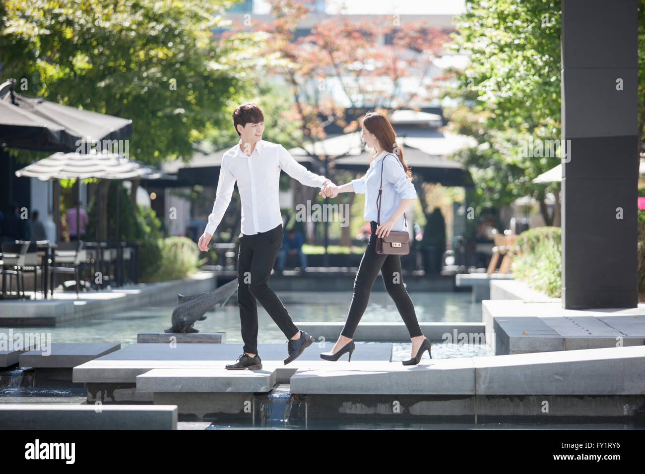 Couple Walking Side View Side View Shot Of Loving Young Couple