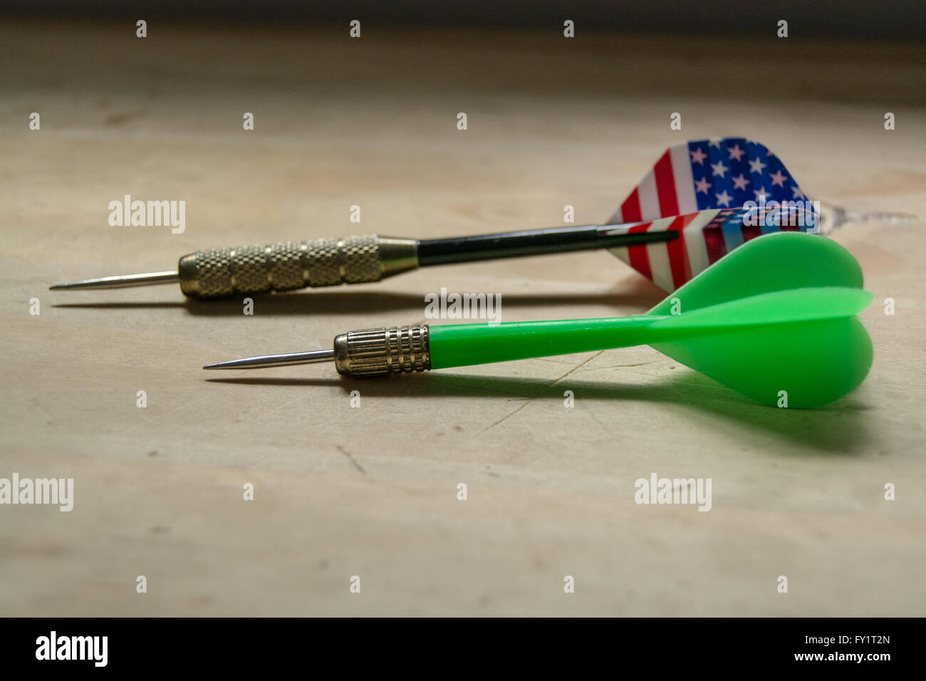 Two darts of different size Stock Photo - Alamy