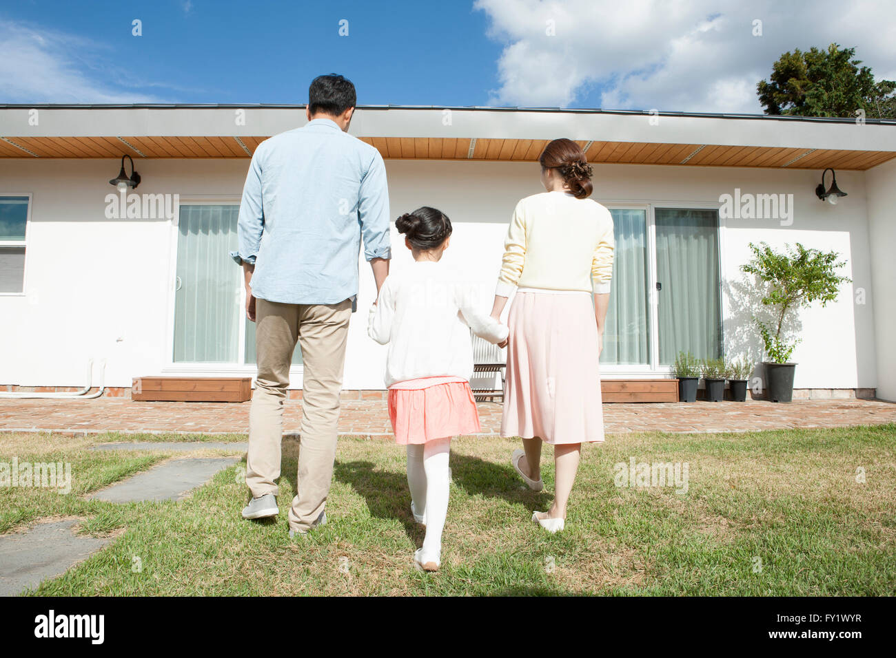 Adult and child walking to house hi-res stock photography and images ...