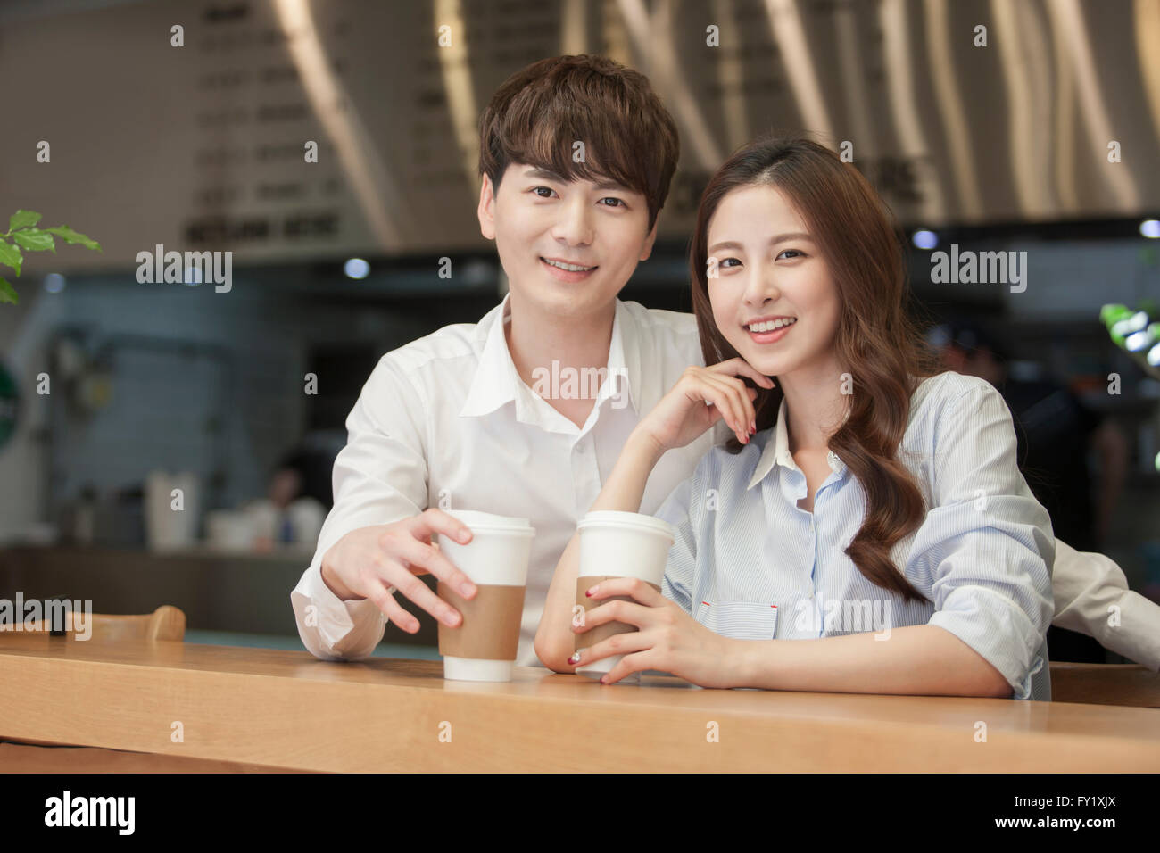 Cafe couple coffee laughing hi-res stock photography and images - Alamy