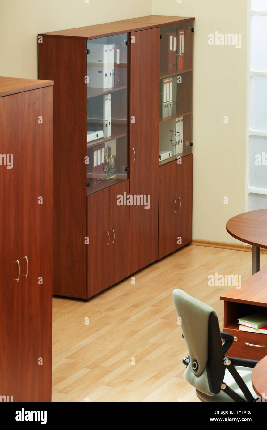 Wooden bookcase with folders at modern office Stock Photo - Alamy