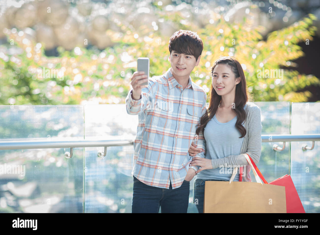 Couple on a date taking a self picture together with a smartphone ...