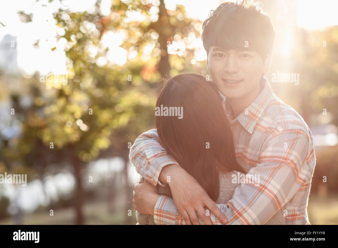 Couple hugging each other in romance Stock Photo - Alamy