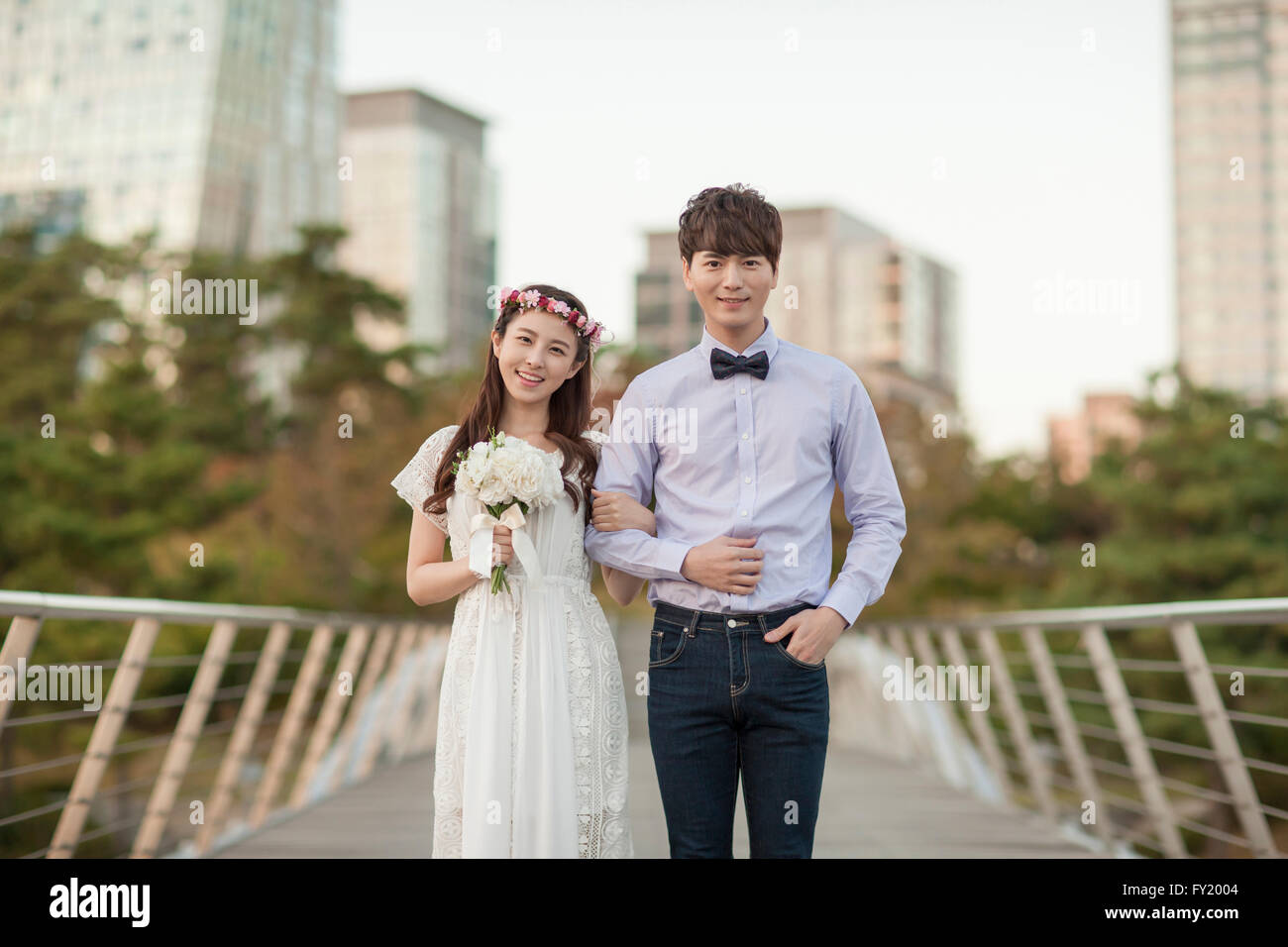 Three women on a bridge hi-res stock photography and images - Alamy