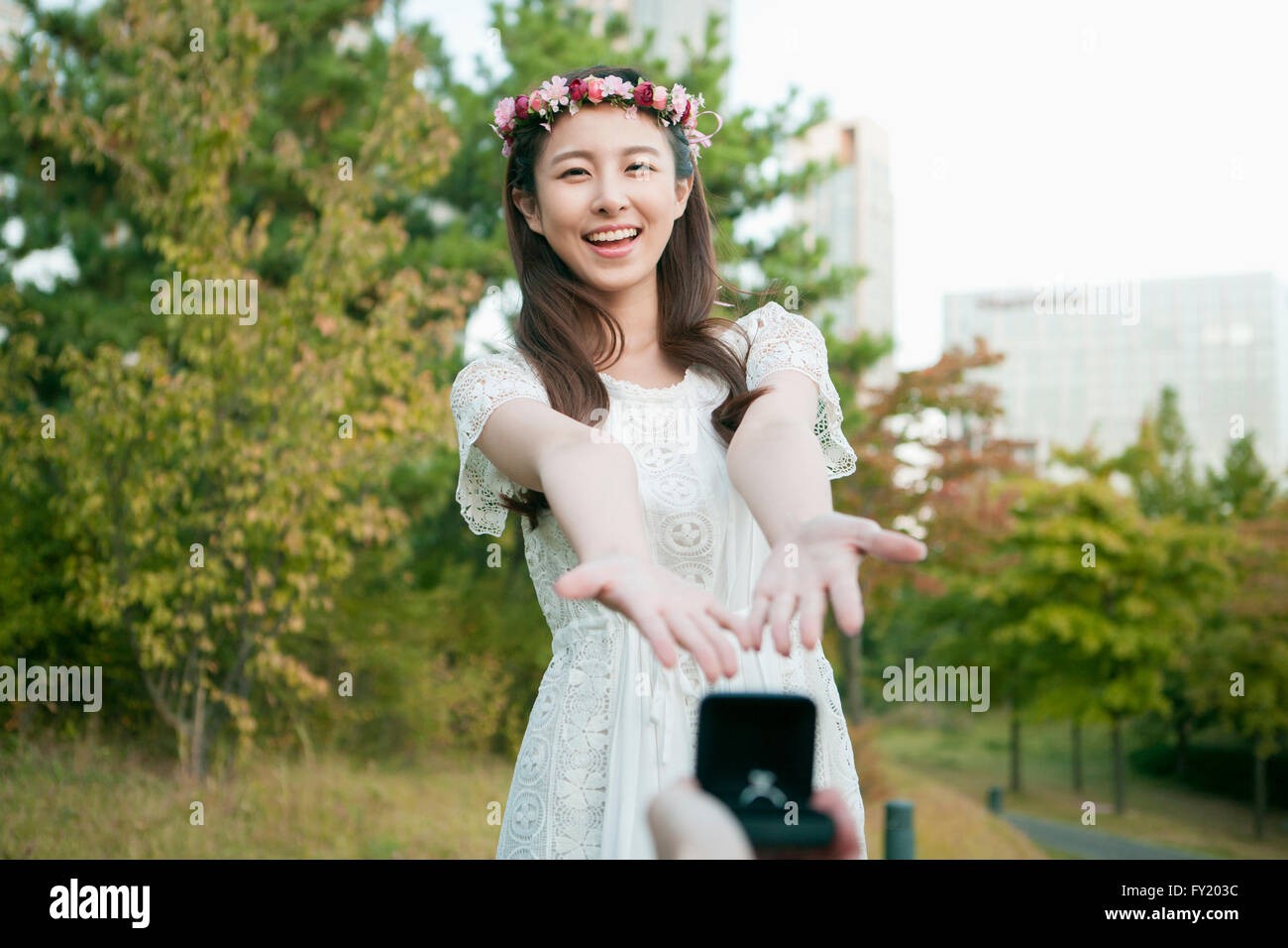 Man's hand giving a ring to a bride stretching her hands forward Stock ...