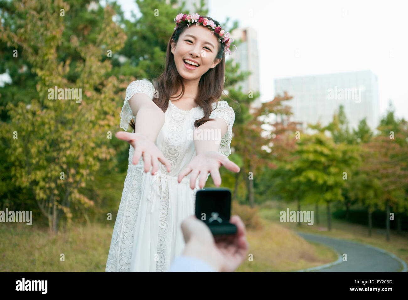 Man's hand giving a ring to a bride stretching her hands forward Stock ...