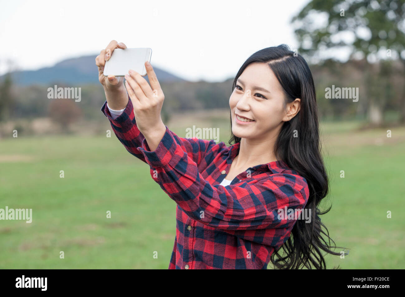 Side view of female taking a selfie hi-res stock photography and images ...