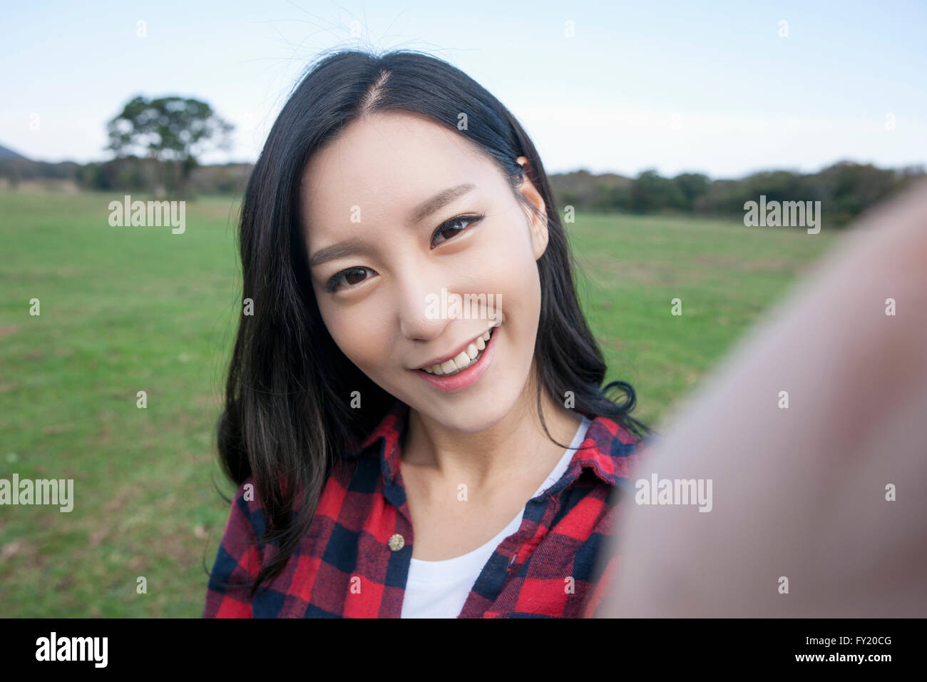 Woman taking a self photo Stock Photo - Alamy