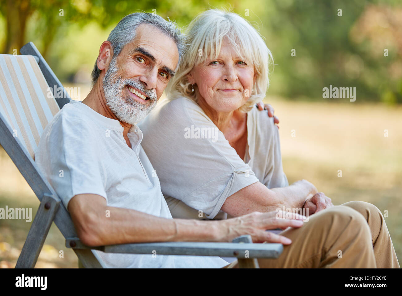 Romantic couple sitting on chair hi-res stock photography and images ...