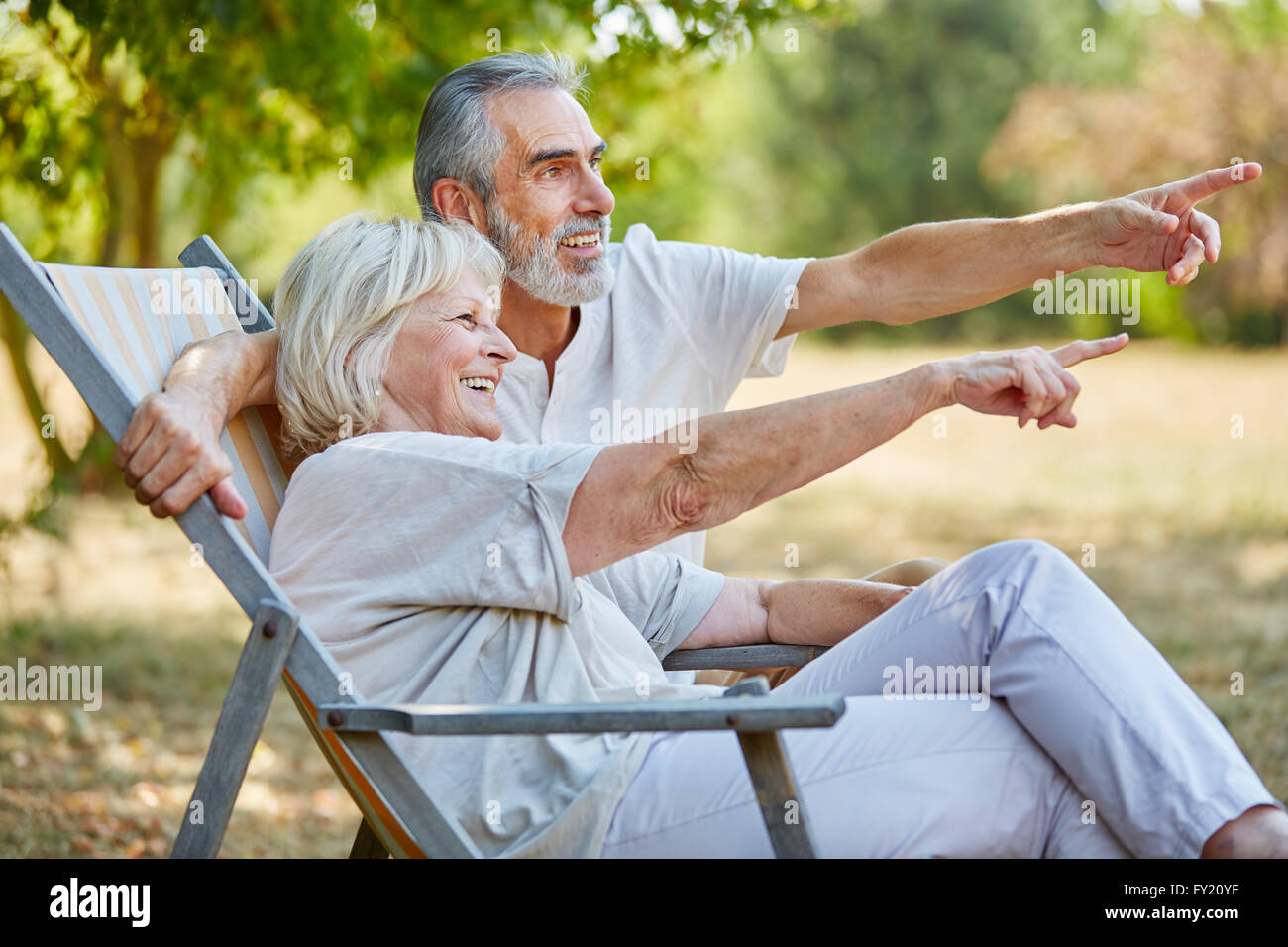 Romantic couple sitting on chair hi-res stock photography and images ...