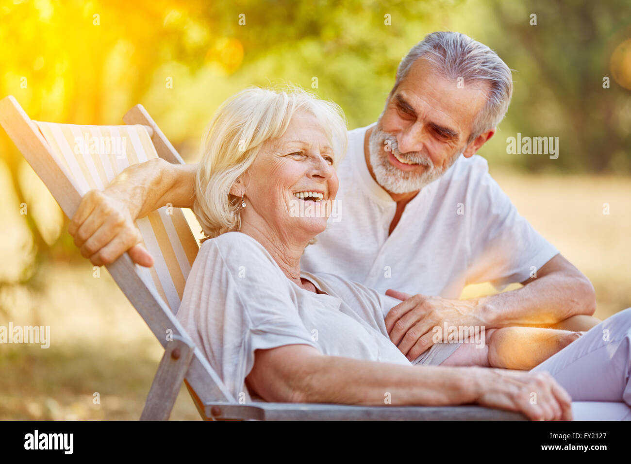 Romantic couple sitting on chair hi-res stock photography and images ...