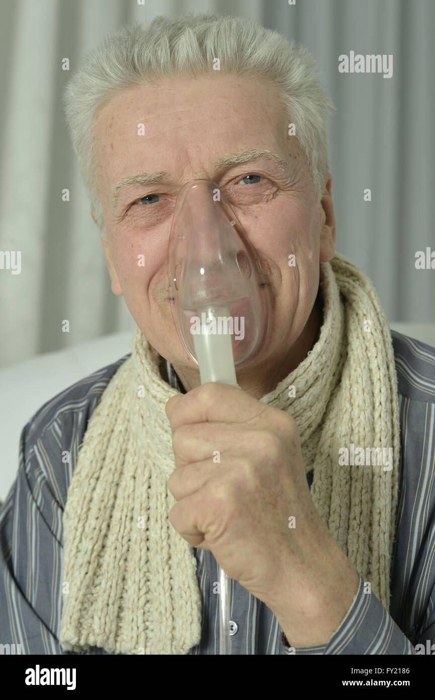 elderly man with flu inhalation Stock Photo - Alamy