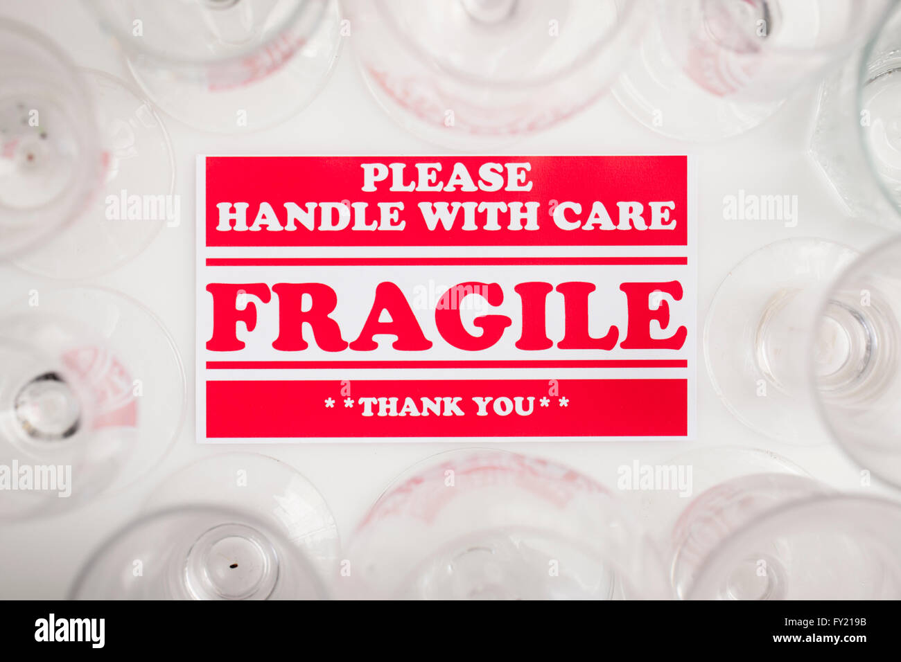 High angle of fragile sign surrounded by glasses Stock Photo - Alamy