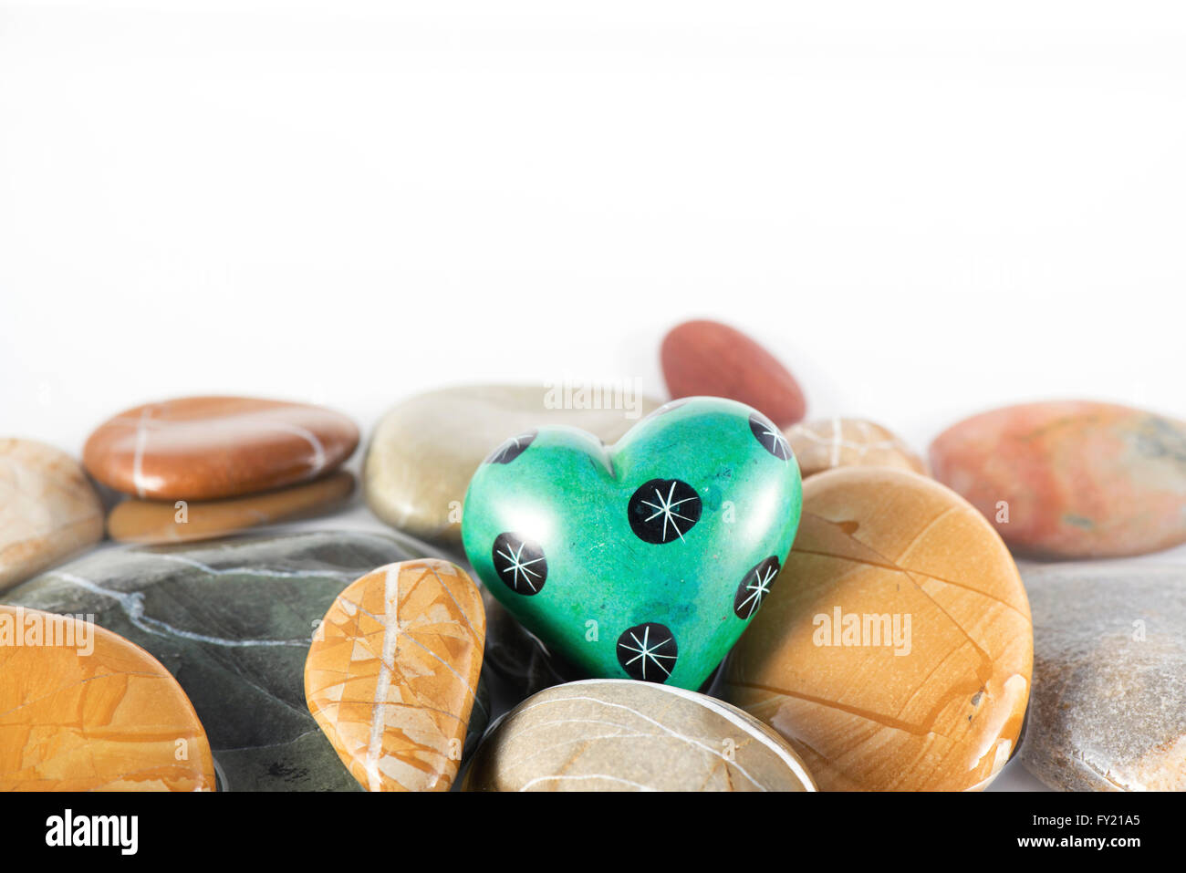 Stone love isolated on white background Stock Photo - Alamy