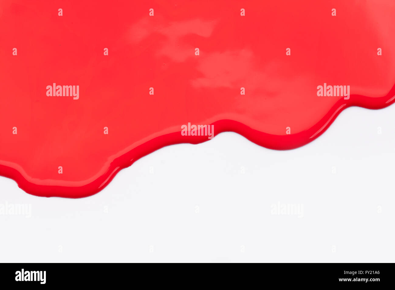 Red flowing paint on white background Stock Photo - Alamy