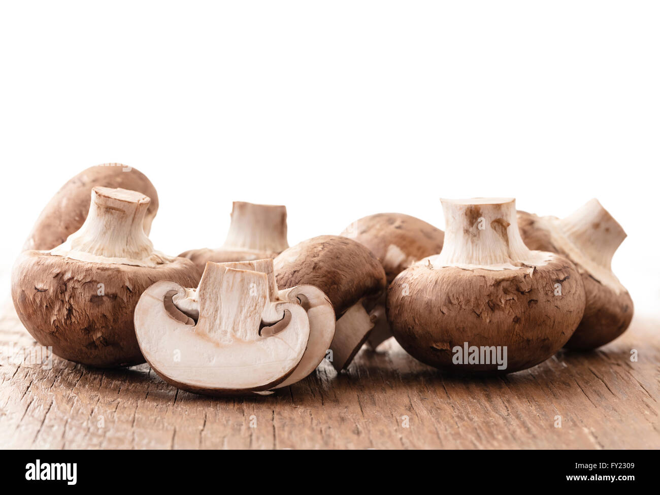 raw natural mushrooms champignon on a wooden board Stock Photo - Alamy
