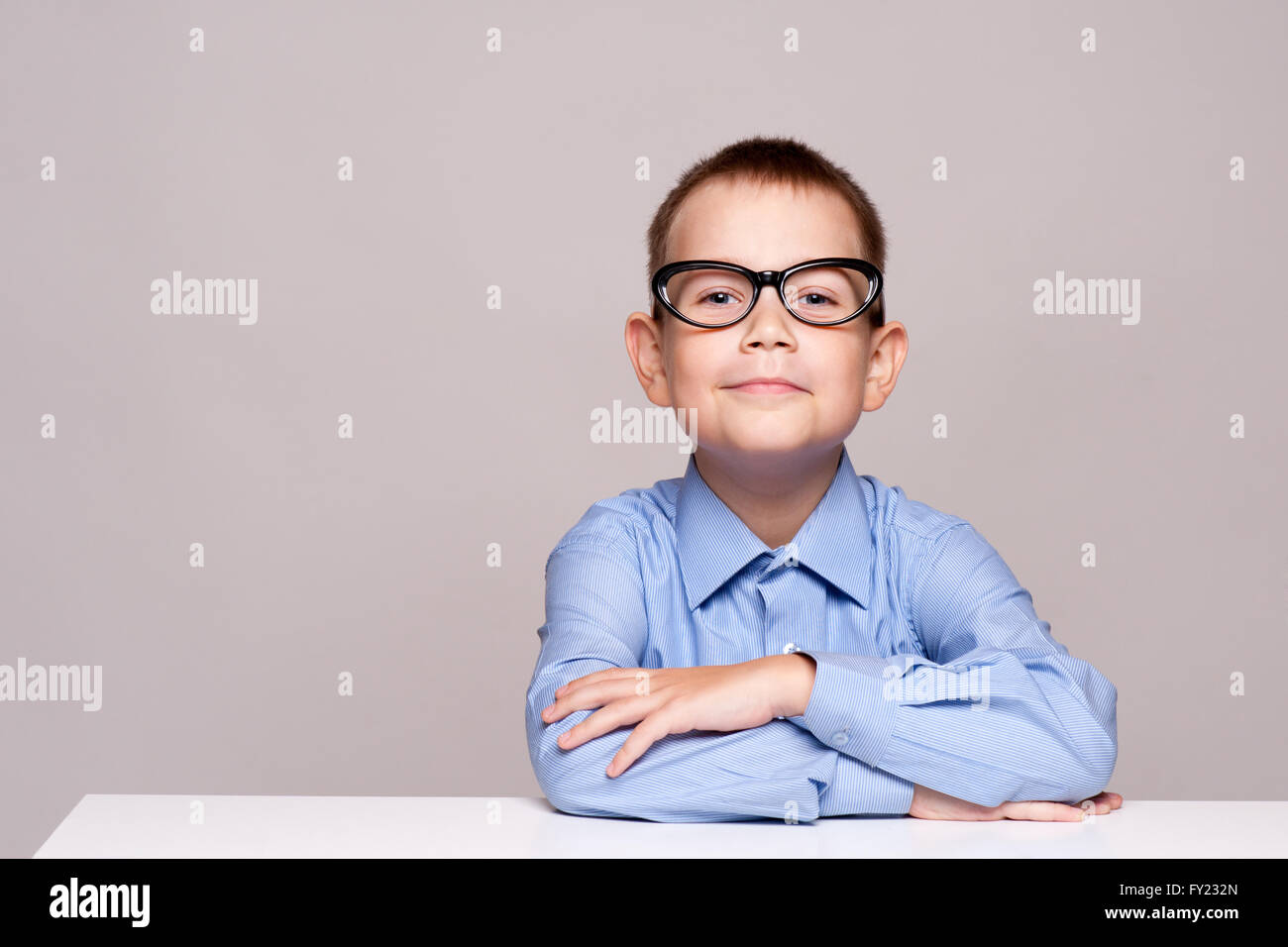 Happy little boy with books isolated on white background Stock Photo ...