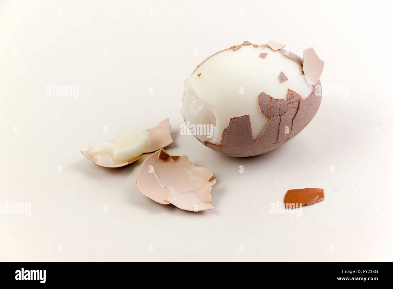 peeled boiled egg on white background Stock Photo - Alamy