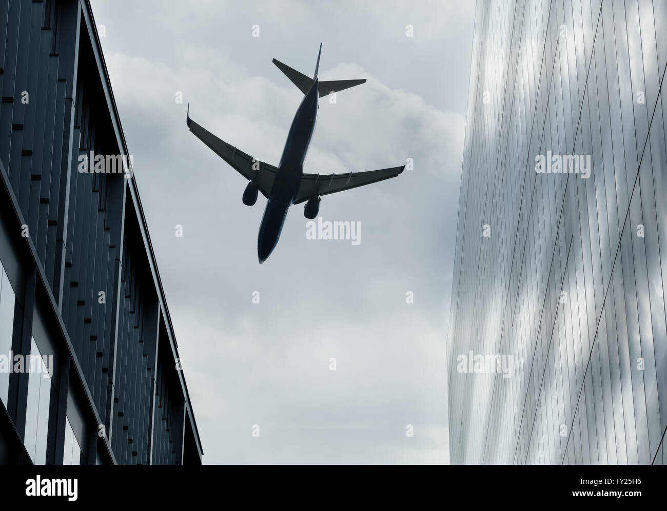 Airplane Flying Over Buildings High Resolution Stock Photography and ...