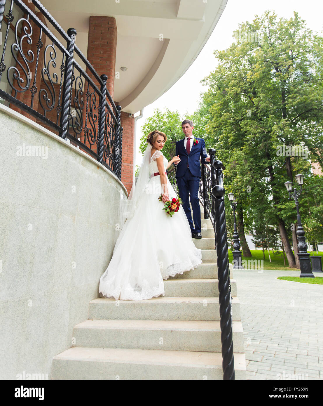 Nice young wedding couple outdoors Stock Photo - Alamy