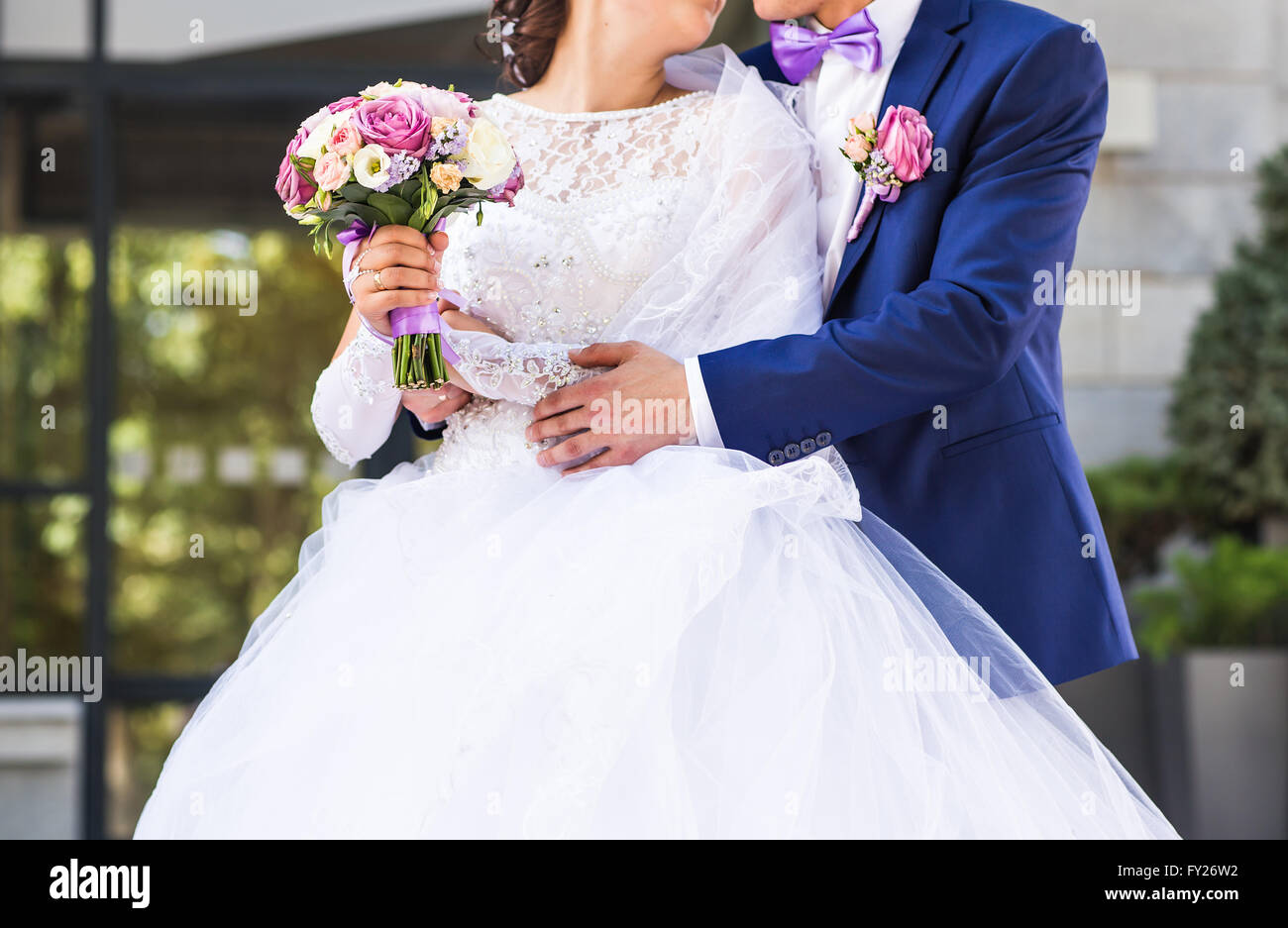 Nice young wedding couple outdoors Stock Photo - Alamy