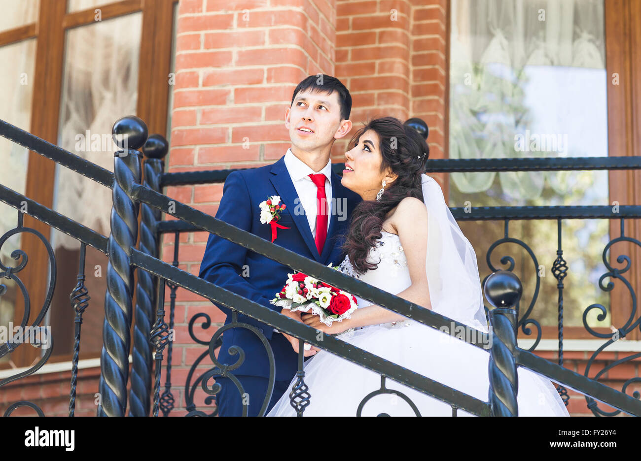 Nice young wedding couple outdoors Stock Photo - Alamy