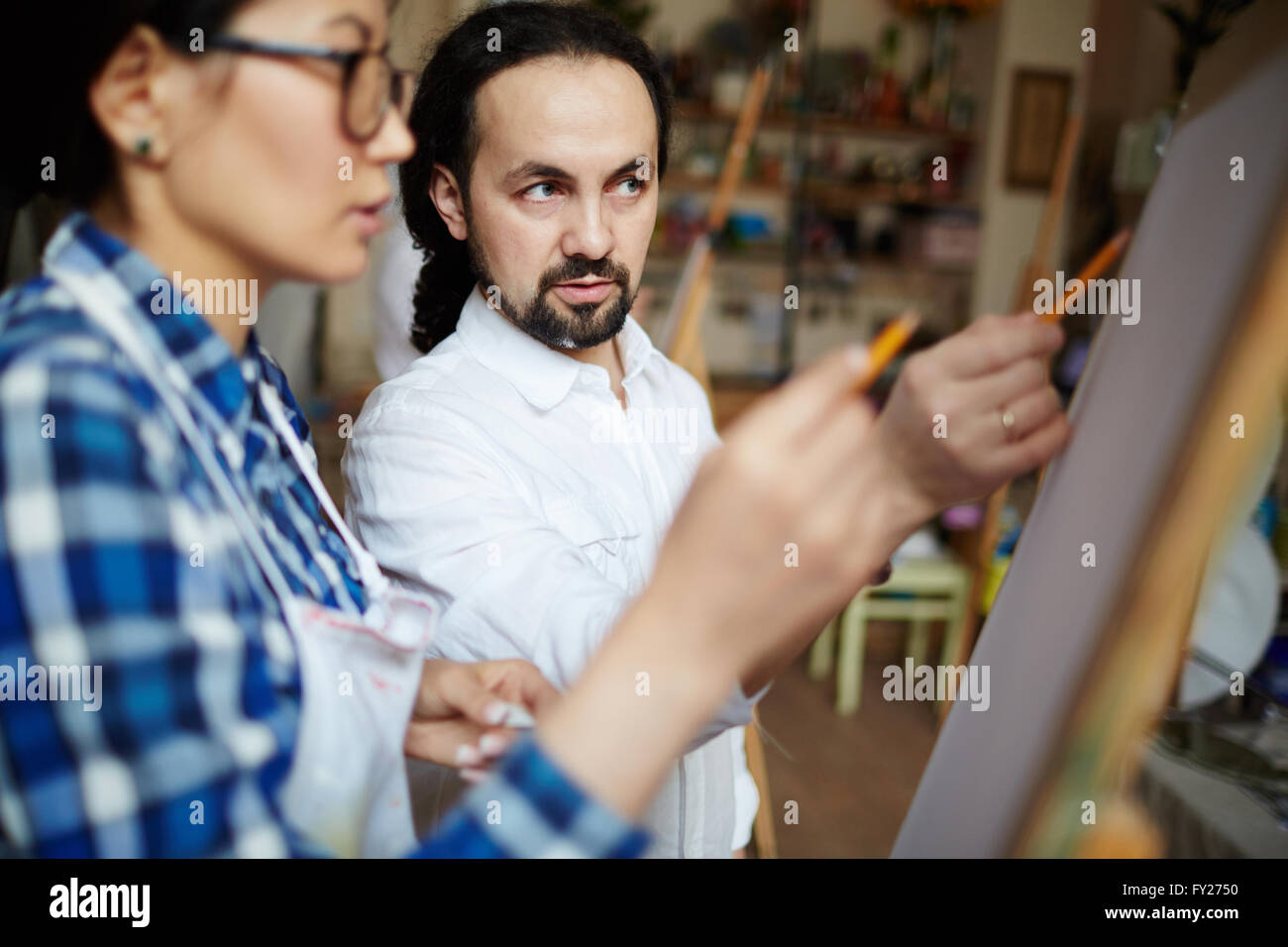Teacher showing painting hi-res stock photography and images - Alamy