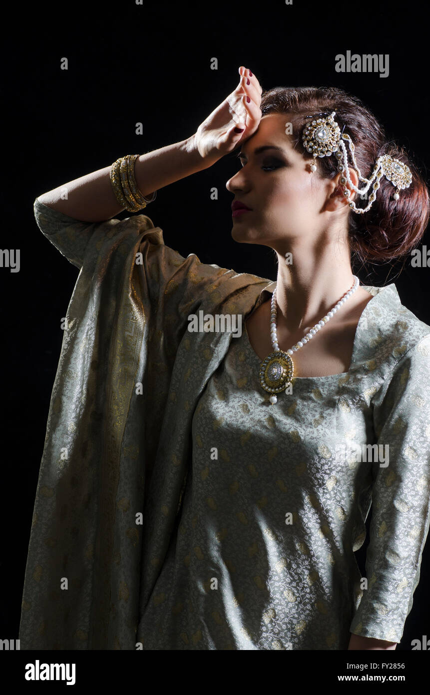 Asian woman hand on head Stock Photo - Alamy