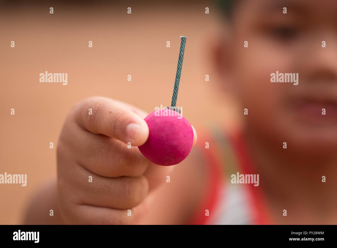 Asia children holding Crackers or firework Stock Photo - Alamy