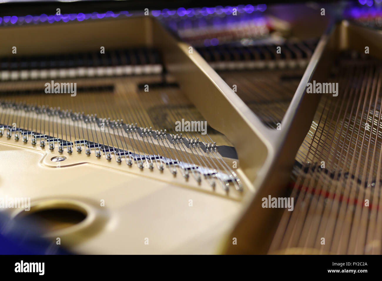 Grand piano strings and hammers with beige rim Stock Photo - Alamy