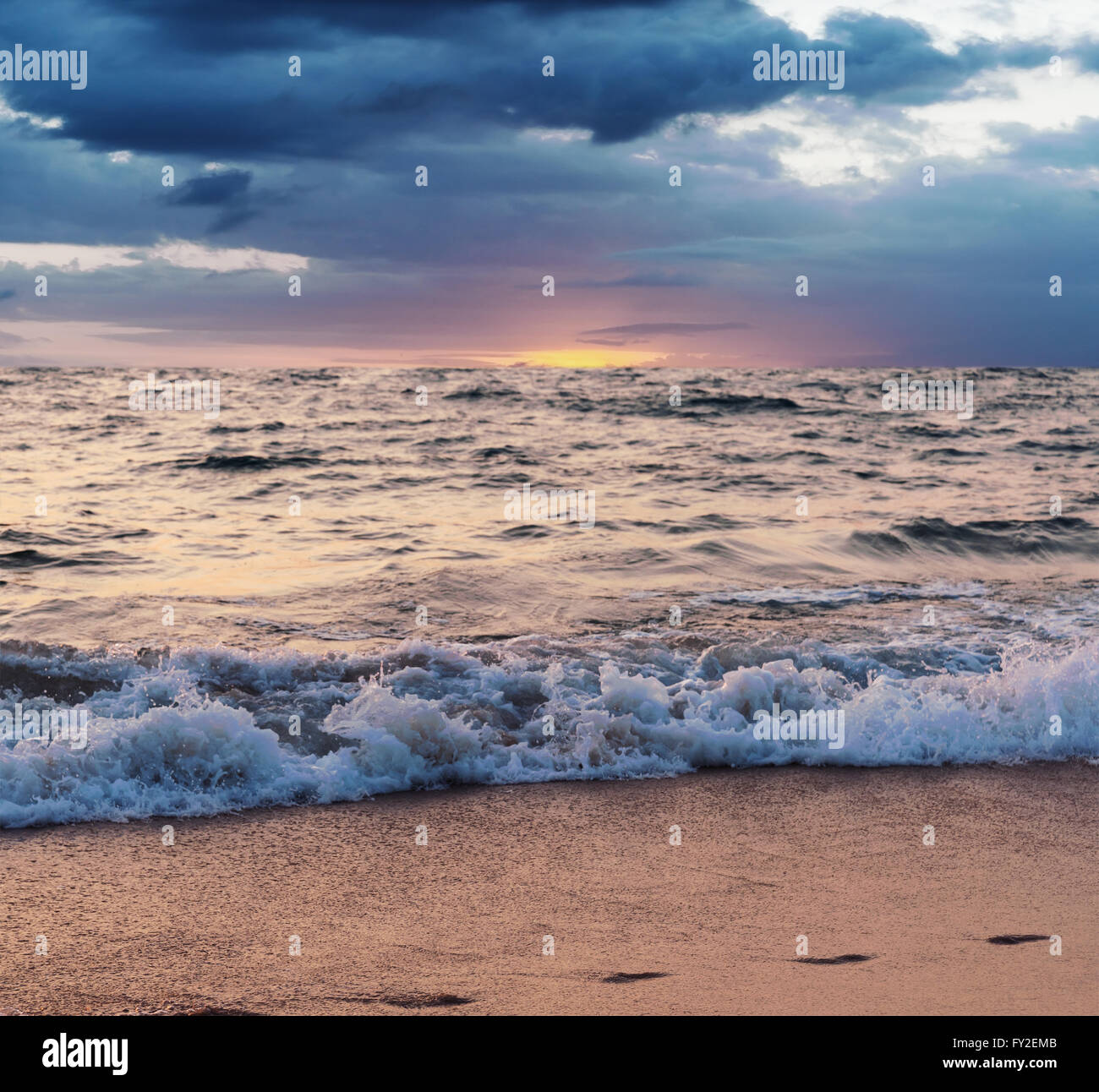 Sea and beach storm with color of the sunset in twilight Stock Photo ...