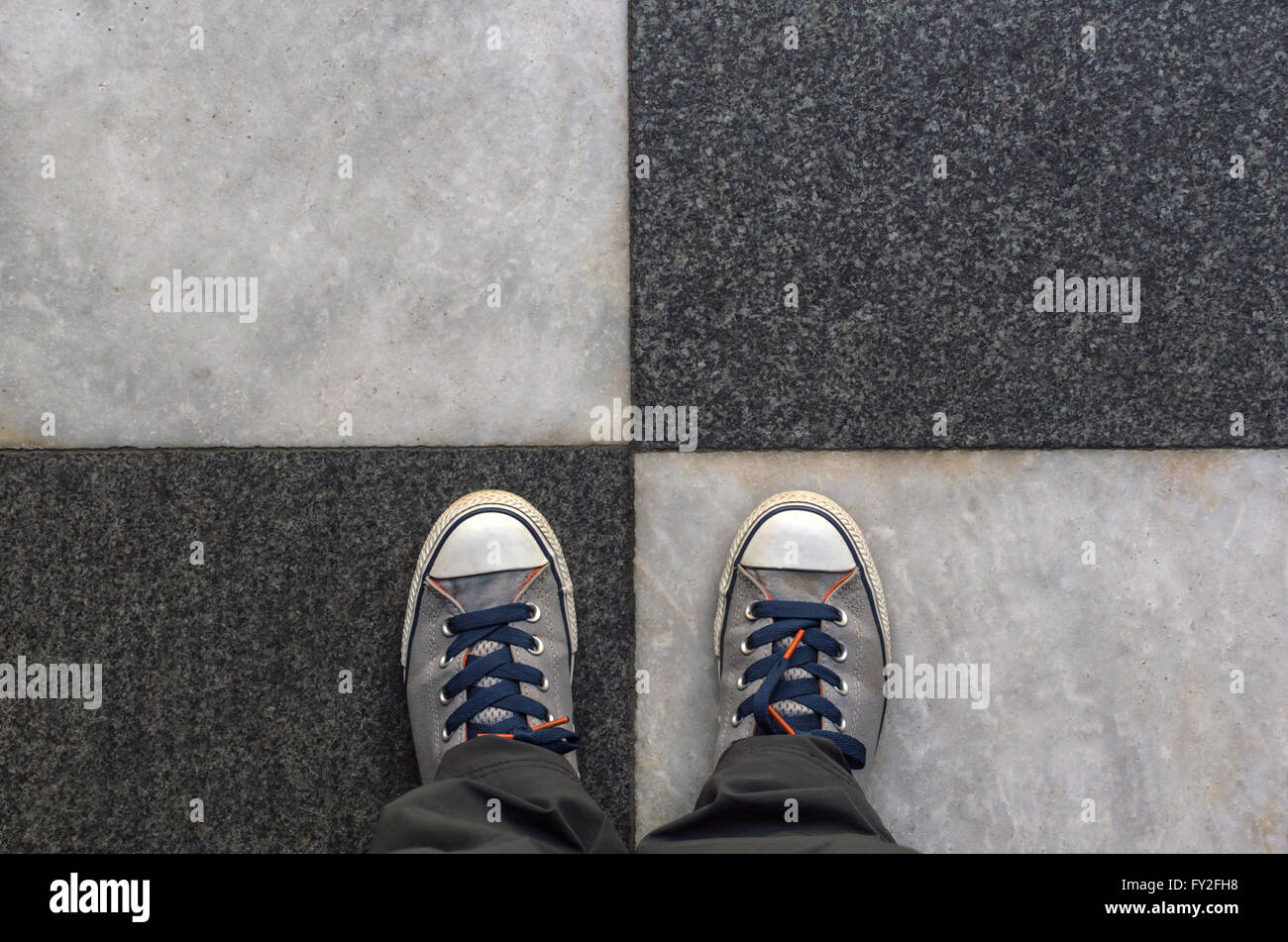 Top of view sneakers on a road. Selective focus Stock Photo - Alamy