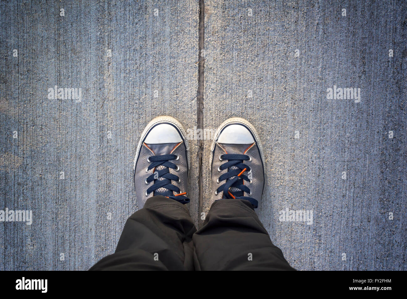 Top of view sneakers on a road. Selective focus Stock Photo - Alamy
