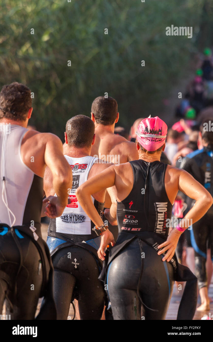Triathletes running sea swim hi-res stock photography and images - Alamy