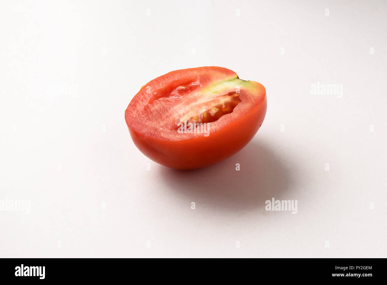 Fresh cut tomato single Stock Photo - Alamy