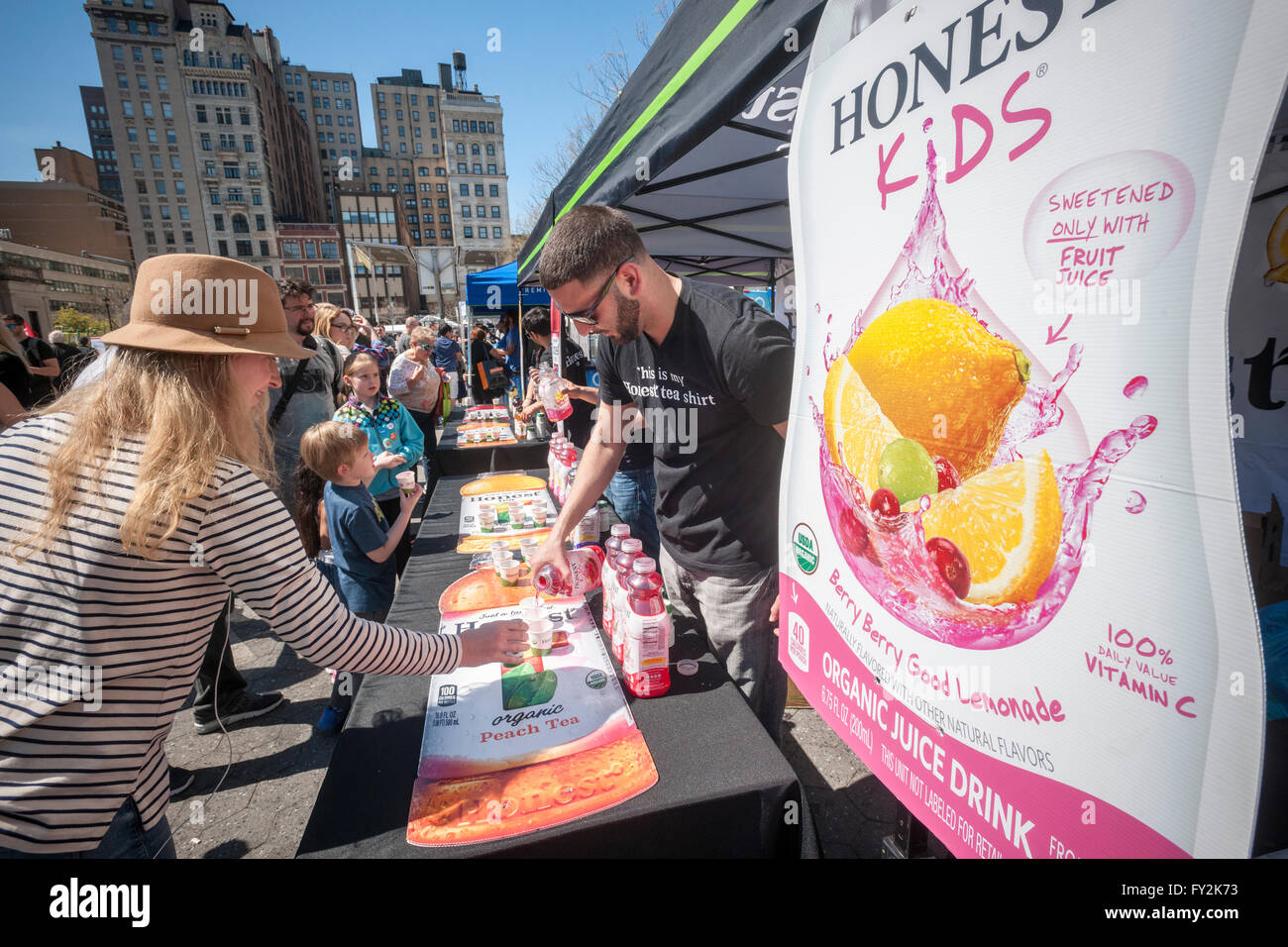 Workers give away samples of Honest Tea at an Earth Day fair in Union ...