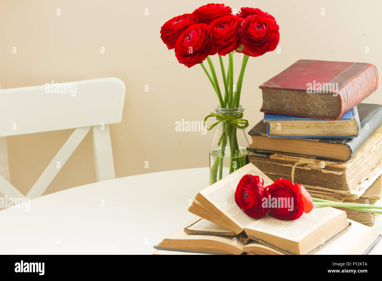 Old books with red flower Stock Photo - Alamy