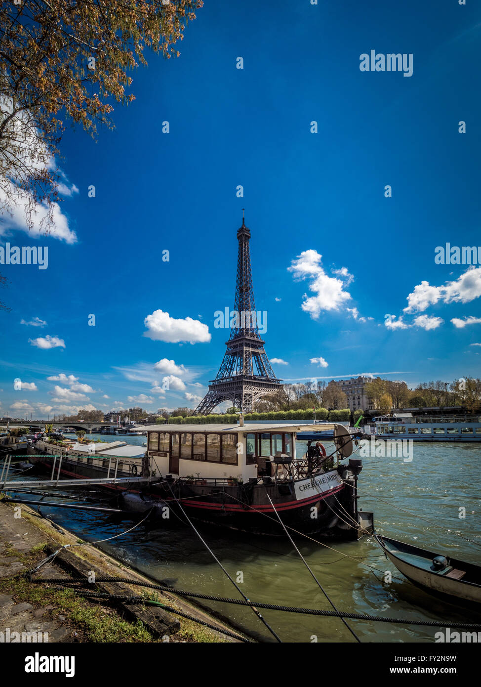 Boats on the river Seine in Paris, France, with Eiffel Tower in ...
