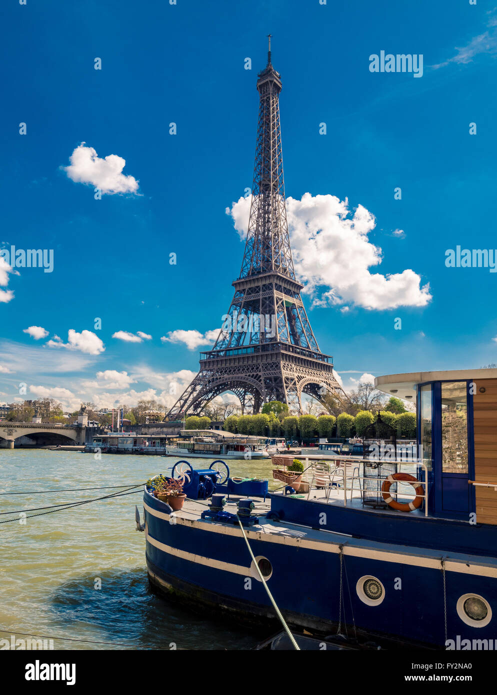 Boats on the river Seine in Paris, France, with Eiffel Tower in ...