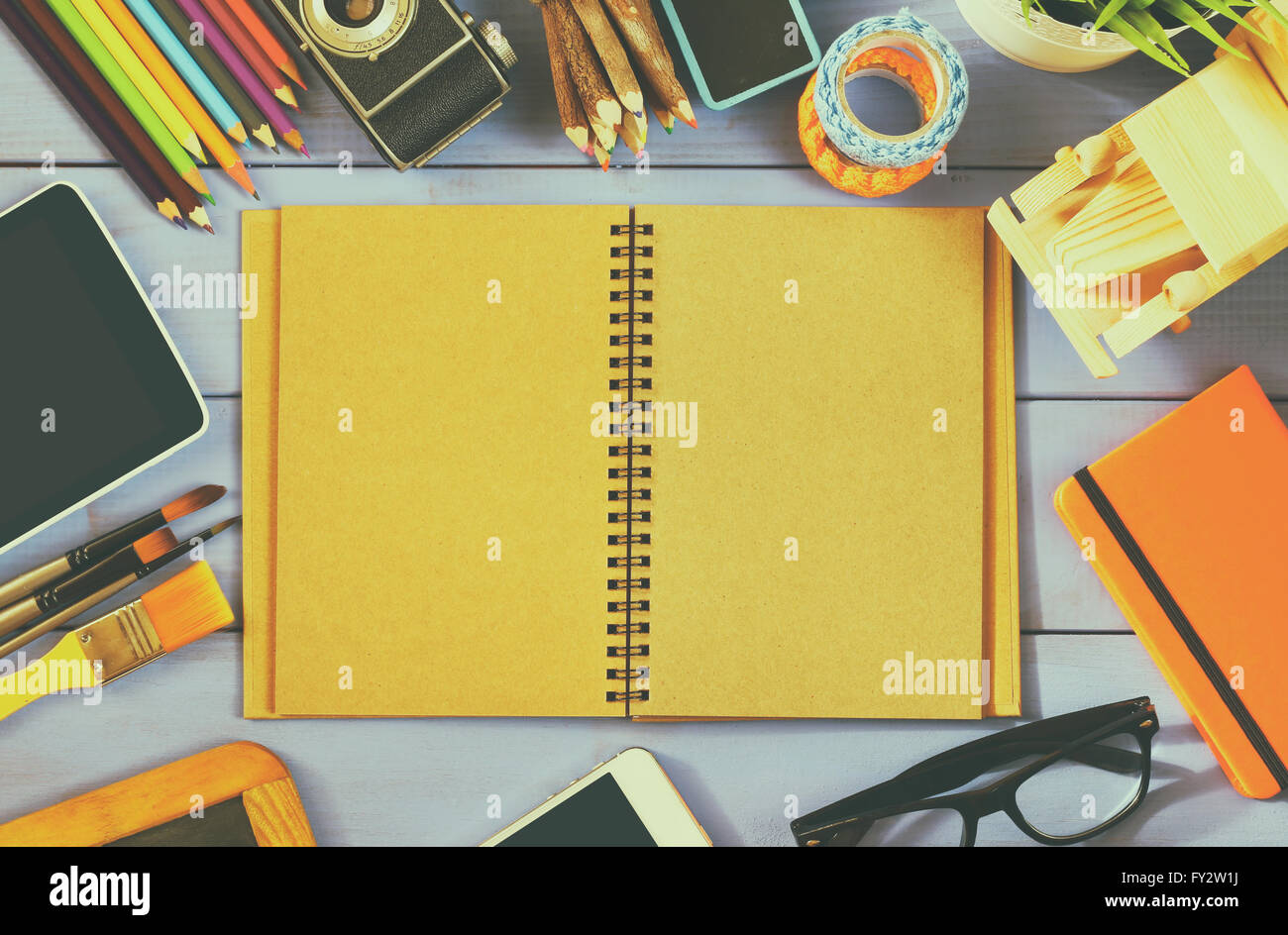 top view photo of blank notebook, old camera and school supplies on ...