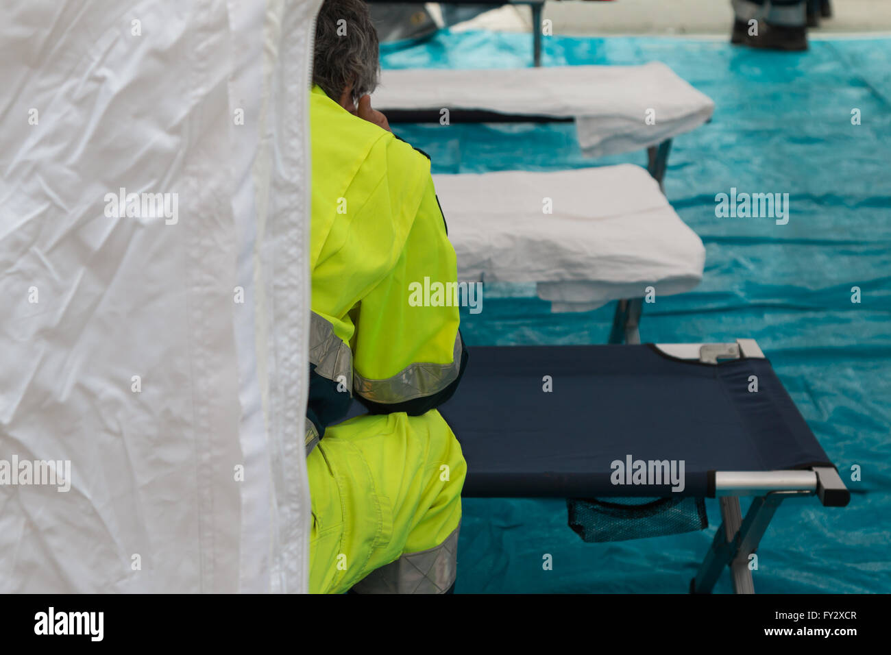 Paramedic Waiting for Emergency inside Temporary Rescue Control Centre ...