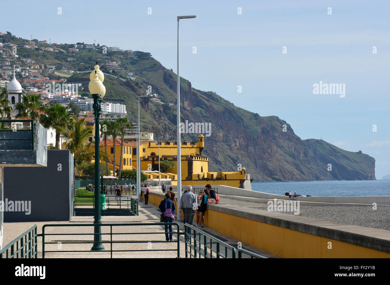 Seafront promenade at Funchal in Madeira, Portugal with people walking ...